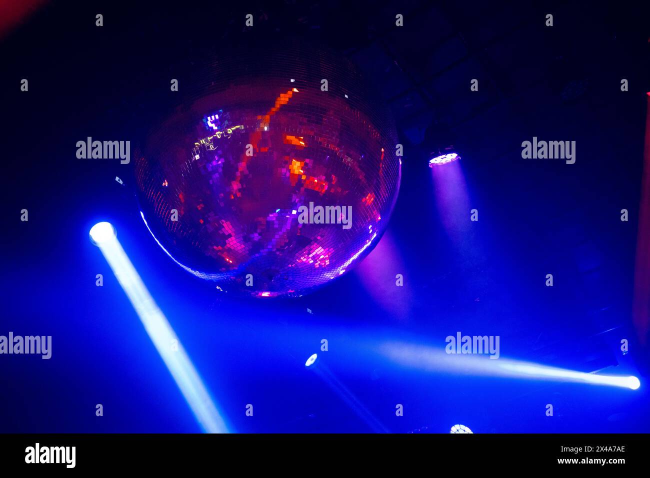 Red and blue colored lights move to the rhythm of the music on the ...