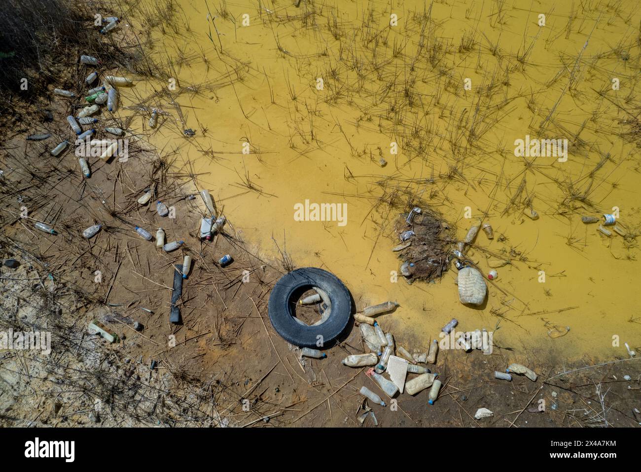 Drone aerial of lake polluted with waste garbage. Environmental ...