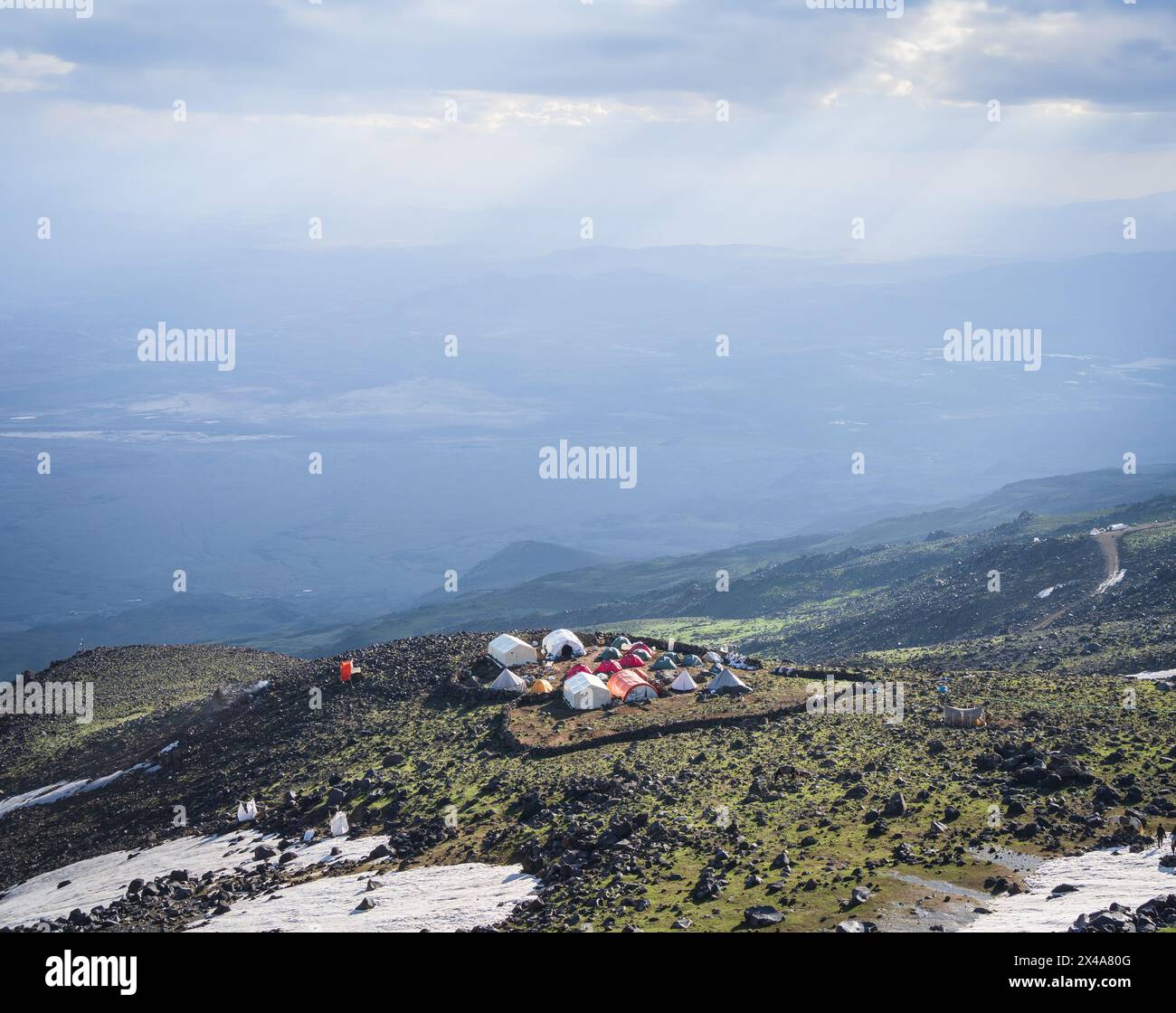 Closer view on a mountain tent camp set in the middle of highlands ...