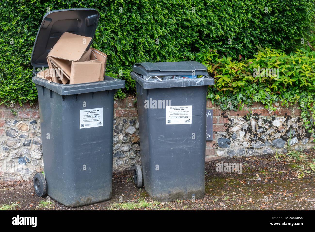 Wheelie bin, recycling bins full of cardboard Stock Photo - Alamy