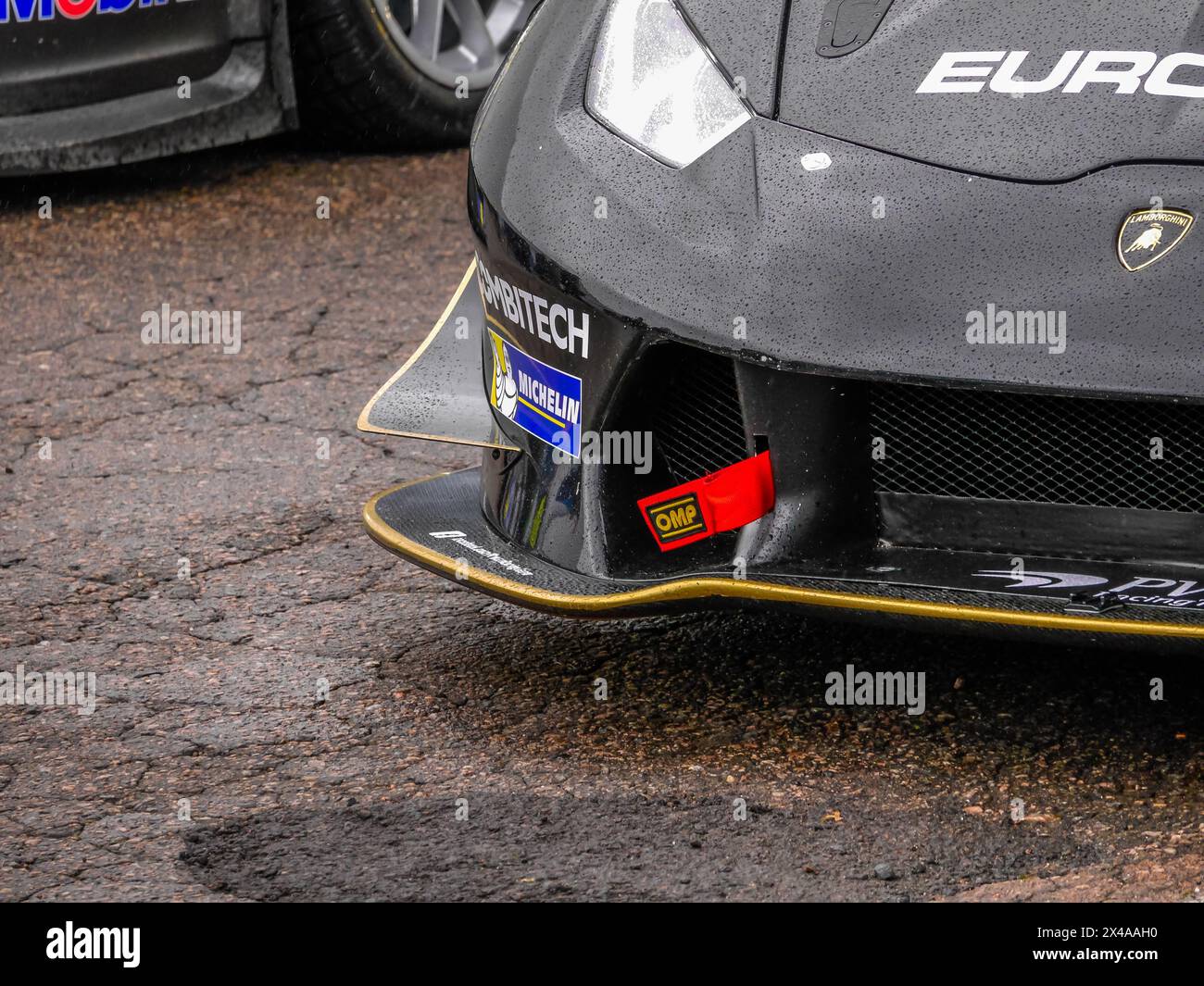 Right side spoiler and front of black Lamborghini Huracan on the ...