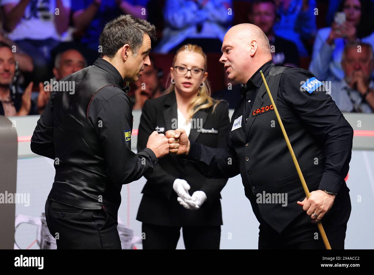 Ronnie O'Sullivan (left) shakes hands with Stuart Bingham (right) after ...
