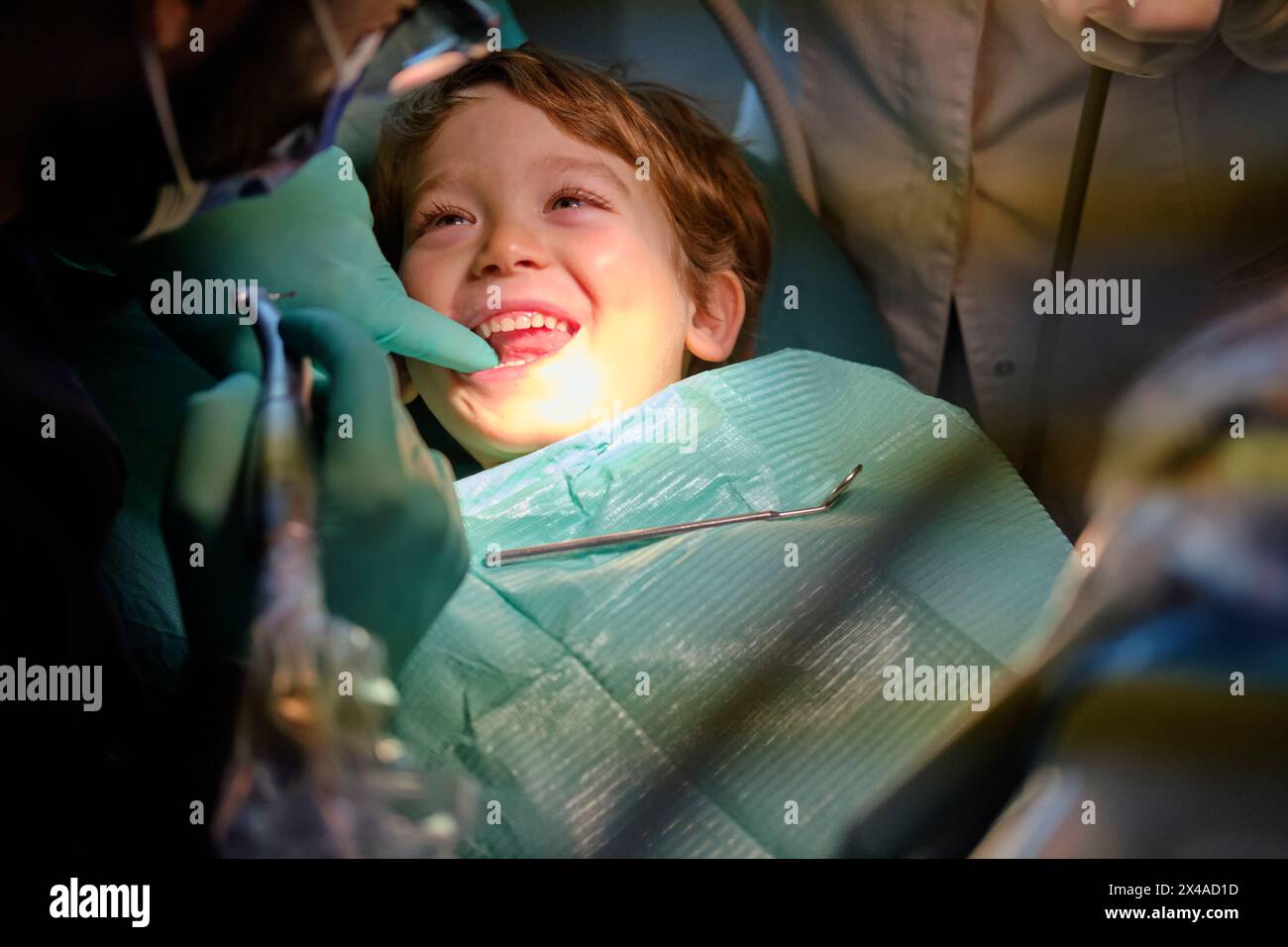 Male child being cured at a dentist clinic Stock Photo - Alamy