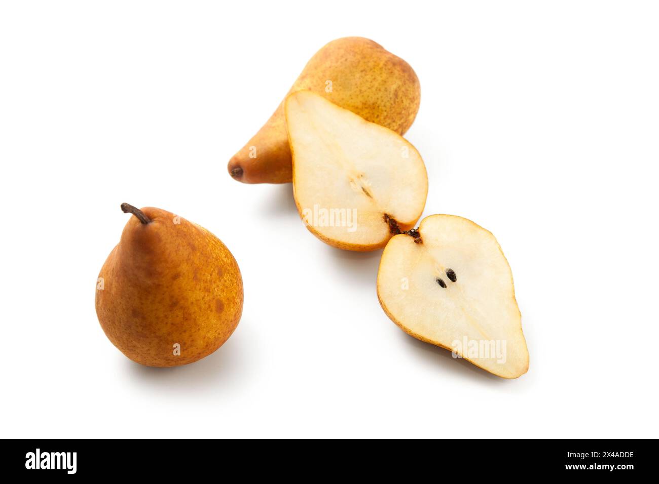 Two whole and halves of ripe juicy pear fruits with soft shadow ...