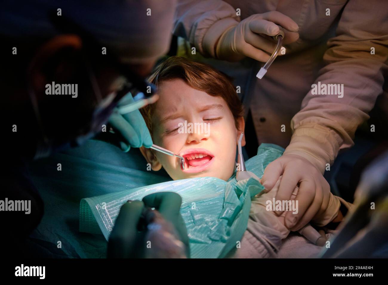 Male child being cured at a dentist clinic Stock Photo - Alamy