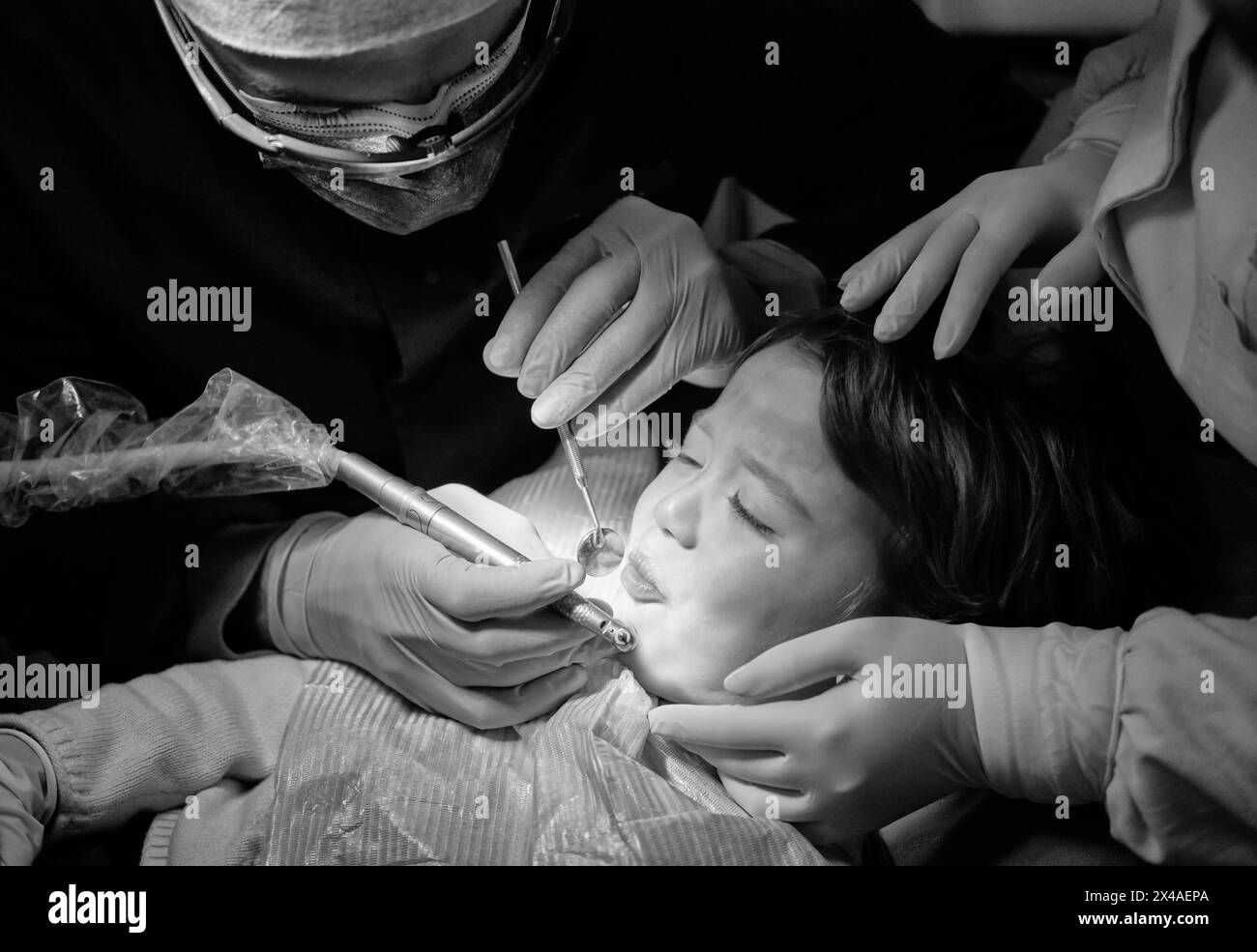 Male child being cured at a dentist clinic Stock Photo - Alamy