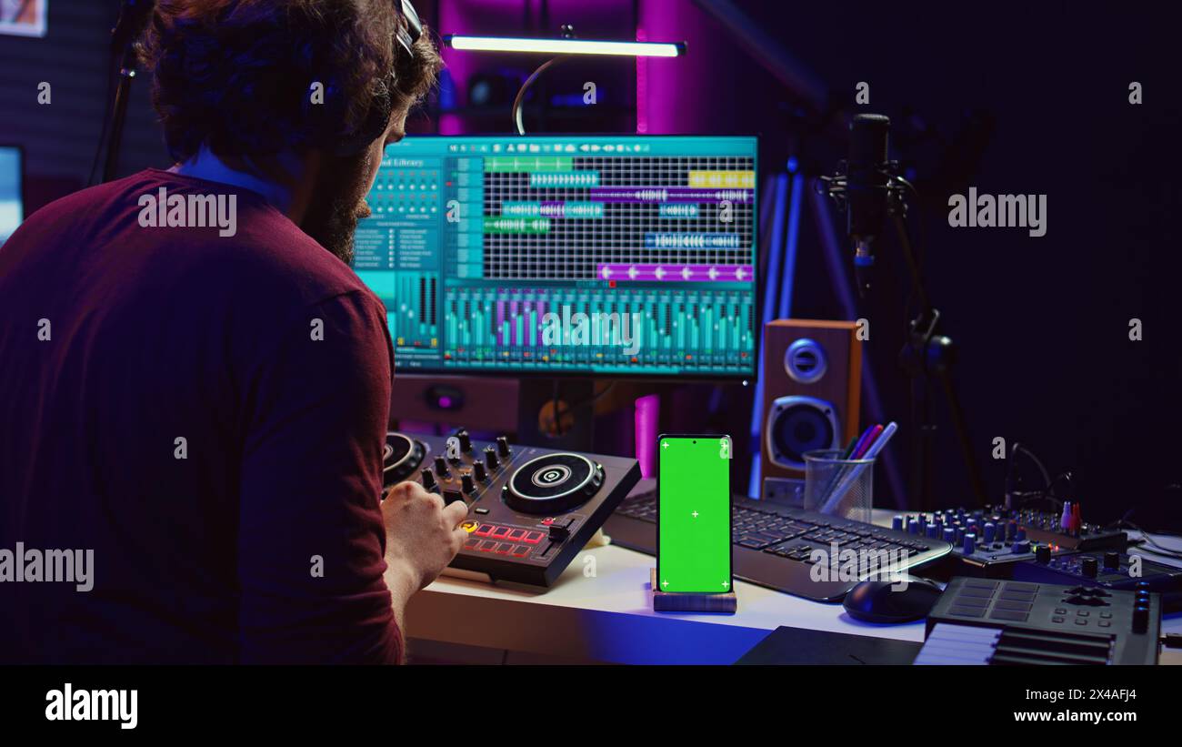 Sound engineer working on mixing and mastering techniques in his home ...