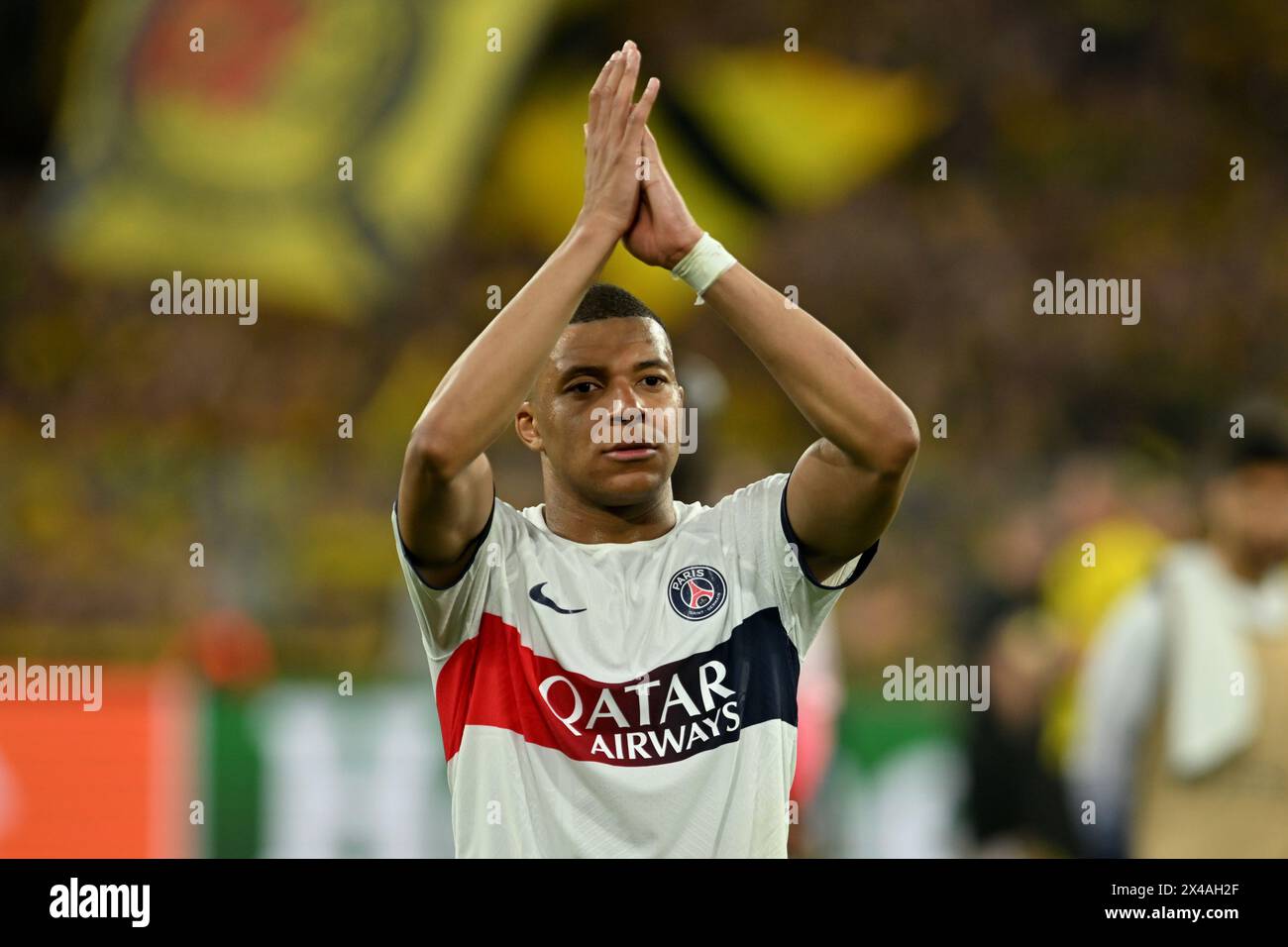 Paris Saint-Germain's Kylian Mbappe applauds the fans after the final ...