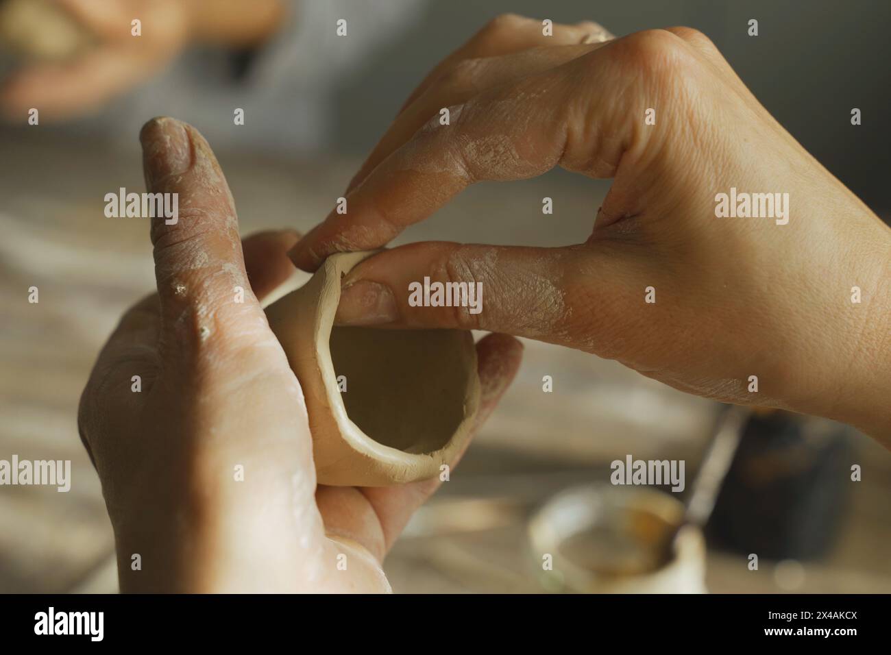 The process of making a clay figurine, shaping the shape of the product ...