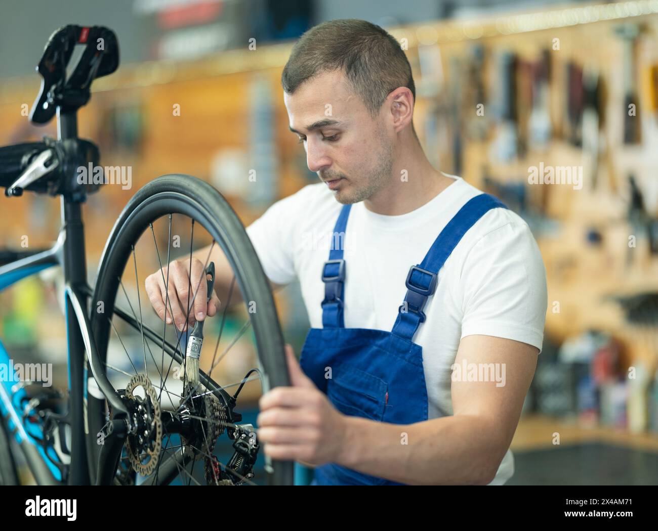 Male oiling bike hi-res stock photography and images - Alamy