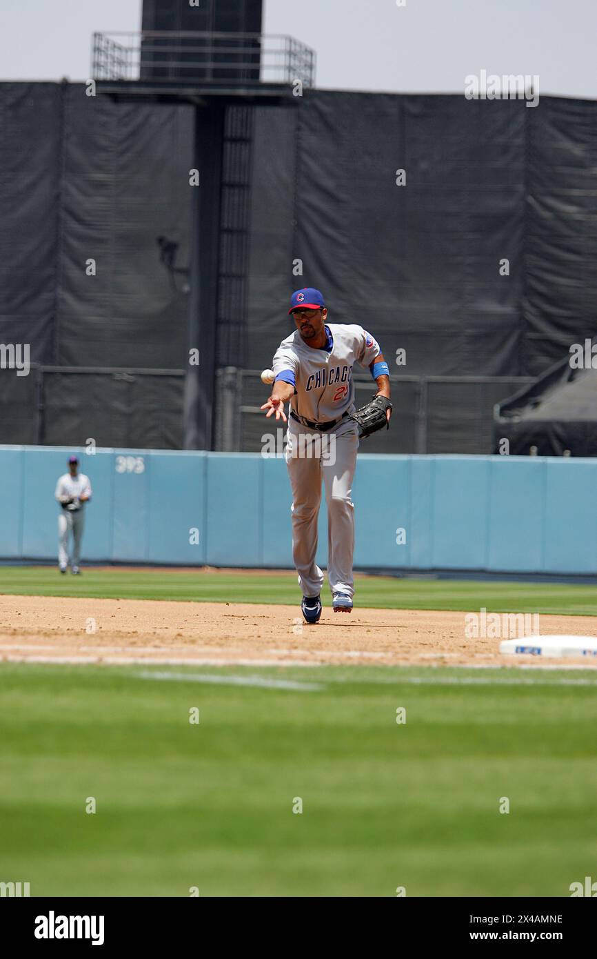 LOS ANGELES, CA - MAY 26: Derrek Lee #25 of the Chicago Cubs tosses an underhand ball to the ...
