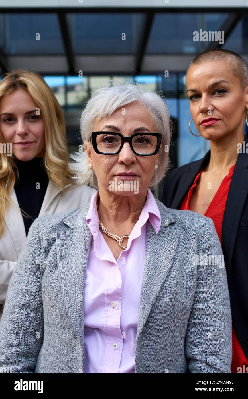 Group of multiracial and diverse ages business women standing in formal ...