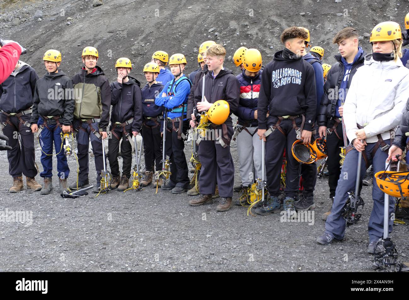 group of people taking an expedition in the Sólheimajökull Glaciar ...
