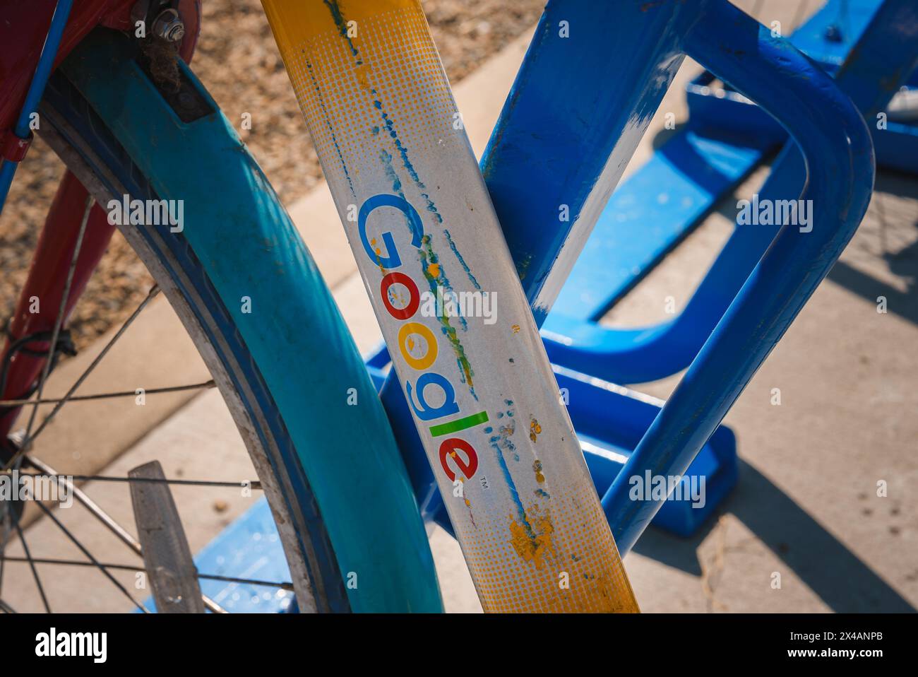 Colorful Google Logo Bicycle Frame Leaning on Blue Structure Outdoors ...