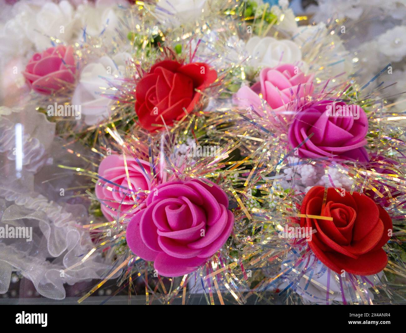 Artificial roses in shop window Stock Photo - Alamy