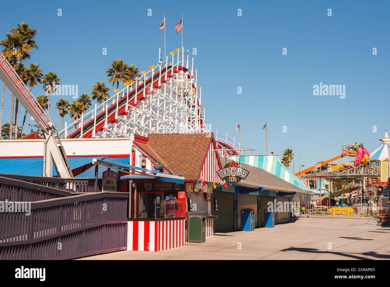 Classic Amusement Park Scene with Ticket Booth and Roller Coaster in ...