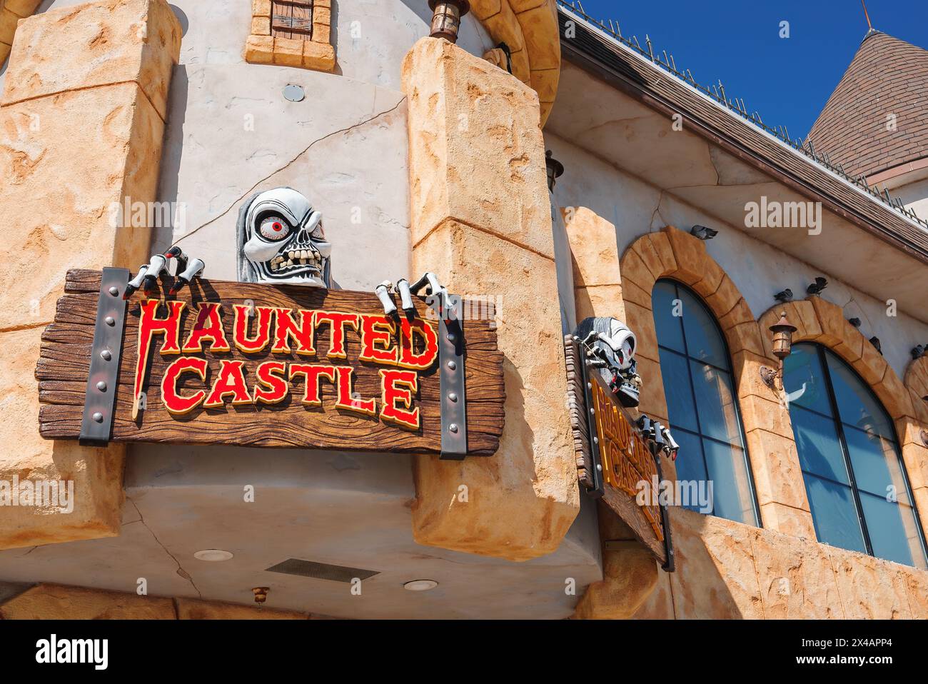 Spooky Haunted Castle Sign in Eerie Castle Facade Stock Photo - Alamy