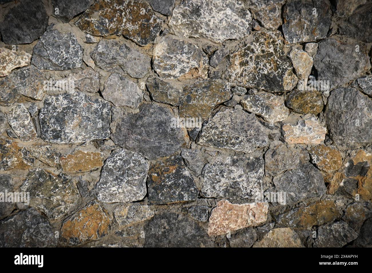 Granite stones of different shapes and colors. Wall cladding. 4 Stock ...