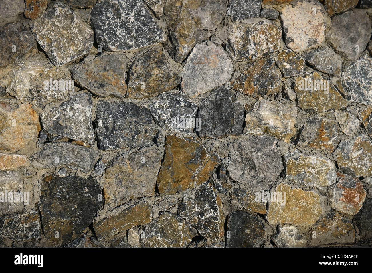 Granite stones of different shapes and colors. Wall cladding. 3 Stock ...