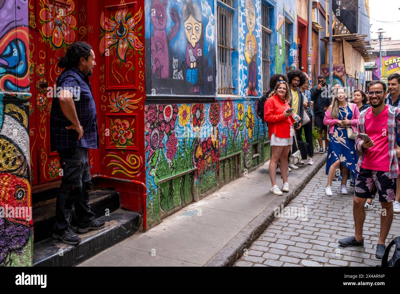 Tourists Pose For Photos Outside Colourful Buildings In The City of ...