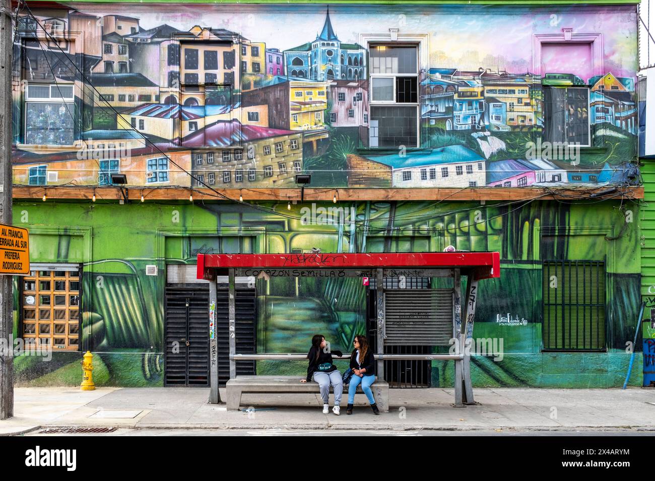 Two Women Chatting At A Bus Stop In The City of Valparaiso, Valparaiso ...