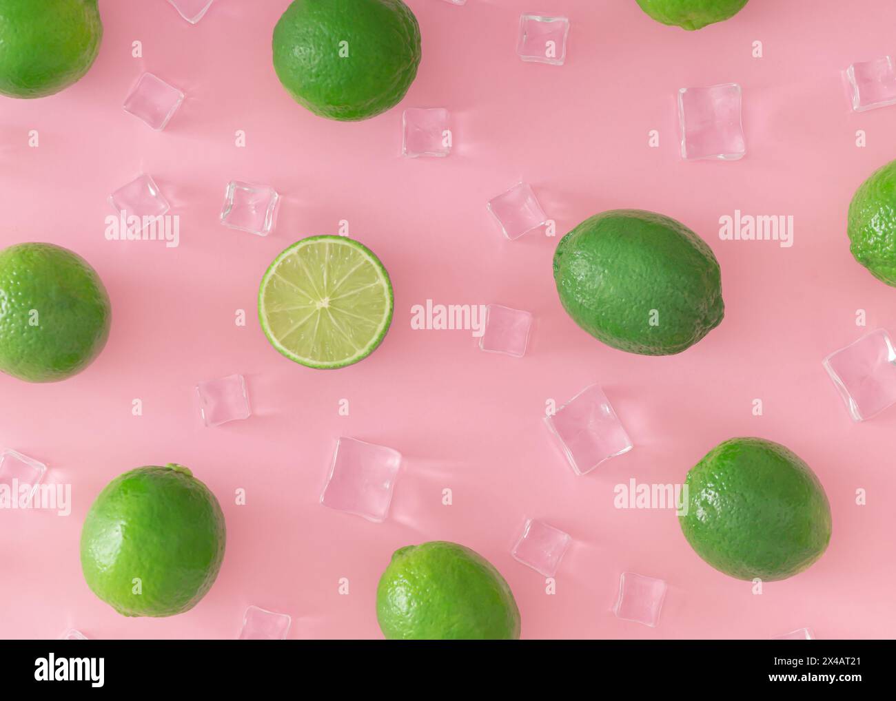 Creative summer pattern made of green lime and ice cubes on light ...