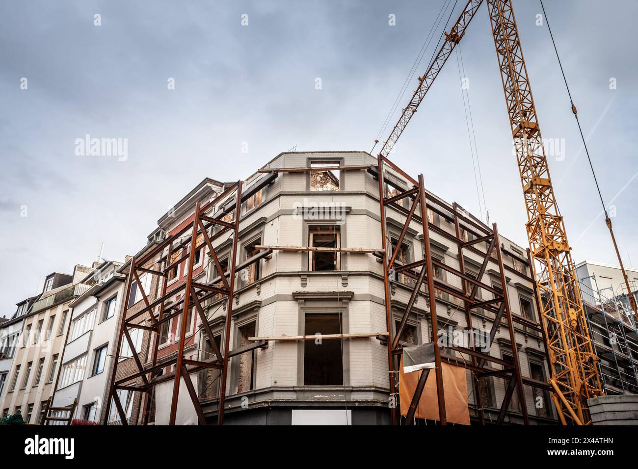 Picture of a corner building being reconstructed in the city center of ...