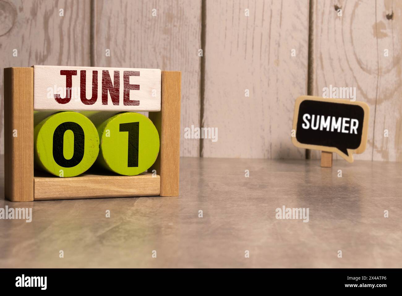 June 1st. Day 1 of month, calendar on yellow background. First summer ...