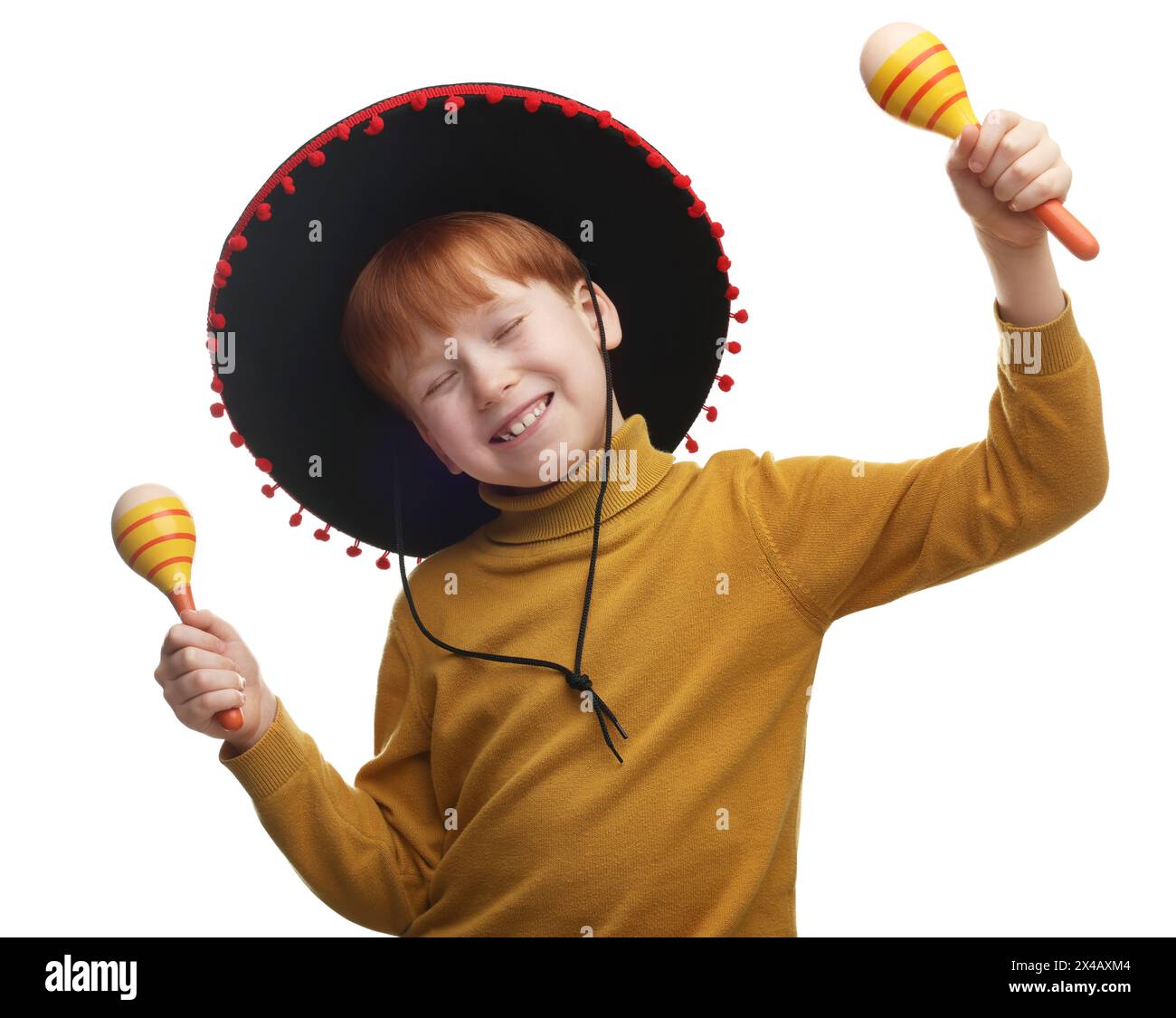 Cute boy in Mexican sombrero hat dancing with maracas on white ...