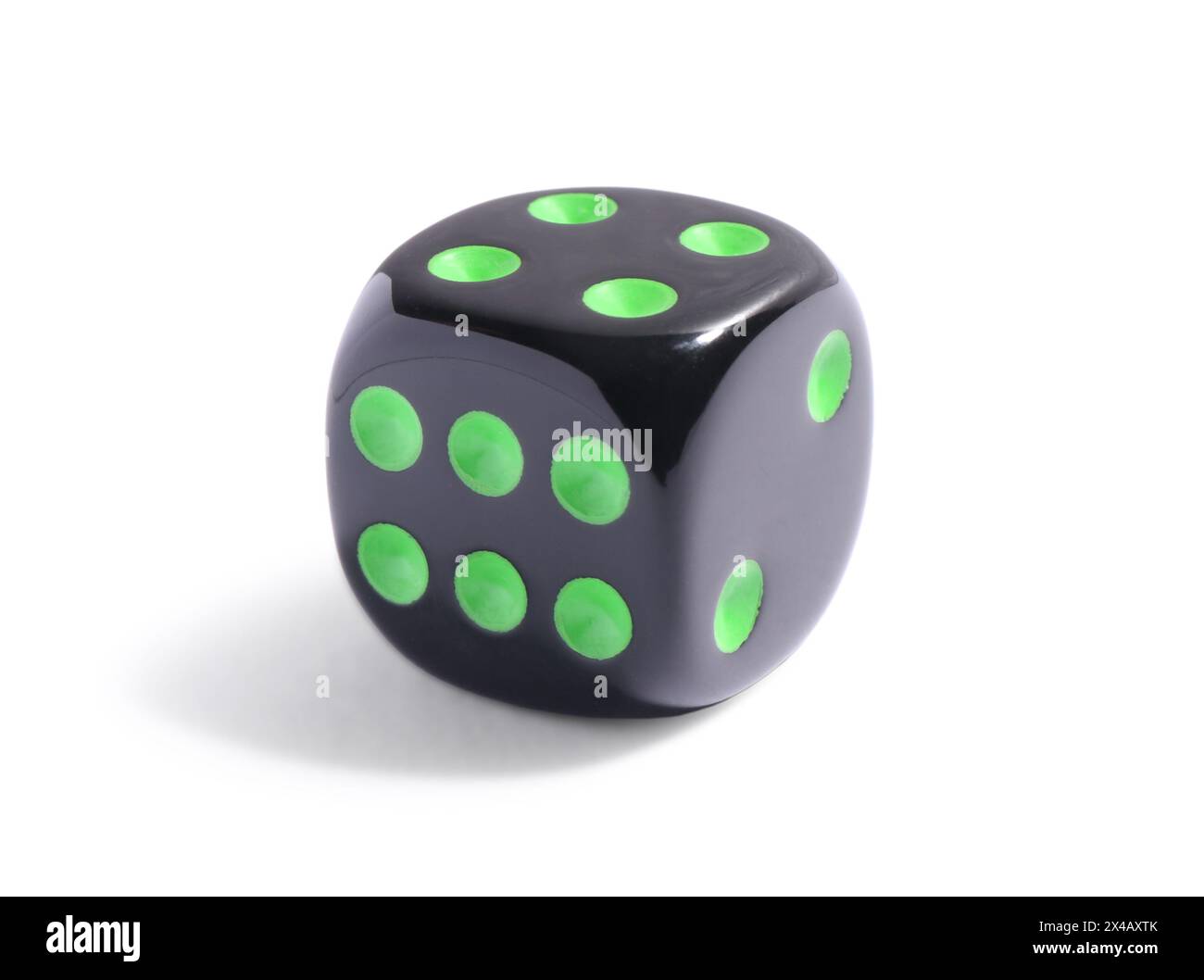 One black game dice isolated on white Stock Photo - Alamy
