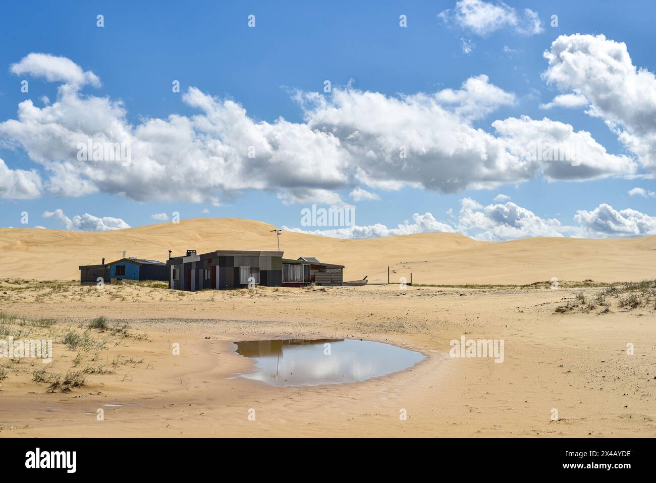 shacks amongst the sand dunes known as Tin City Stock Photo - Alamy