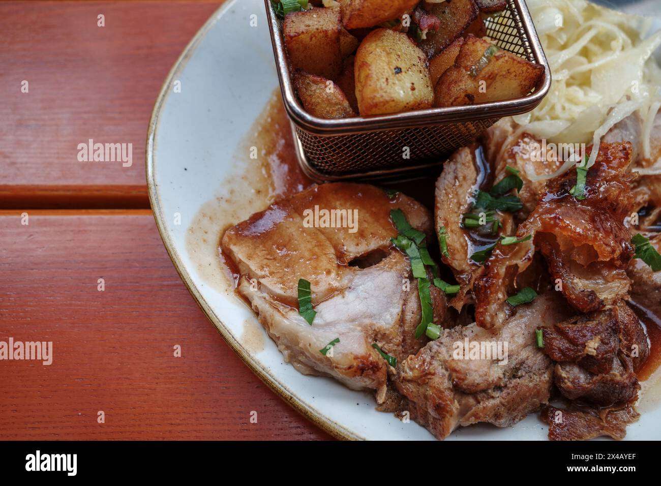 A delicious plate featuring succulent roasted pork, cooked to ...