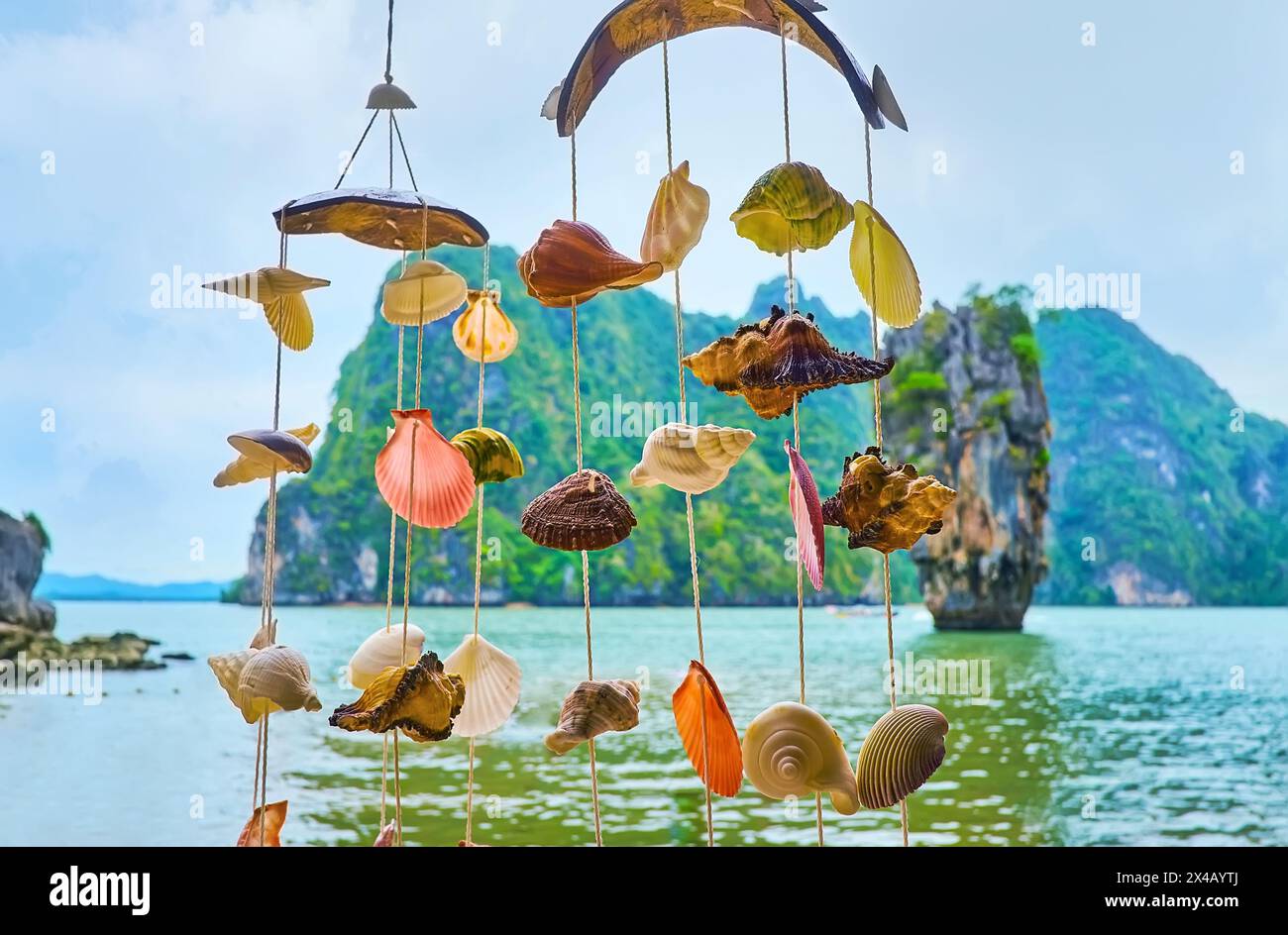 The famous karst tower of Ko Ta Pu stands out against green backdrop of ...