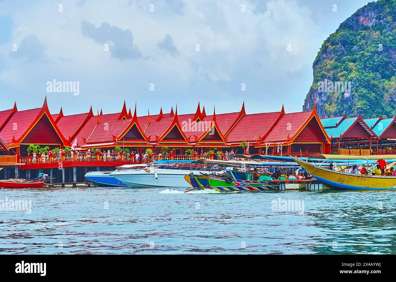 The old kayaks and tourist boats at the shore of stilt Muslim village ...