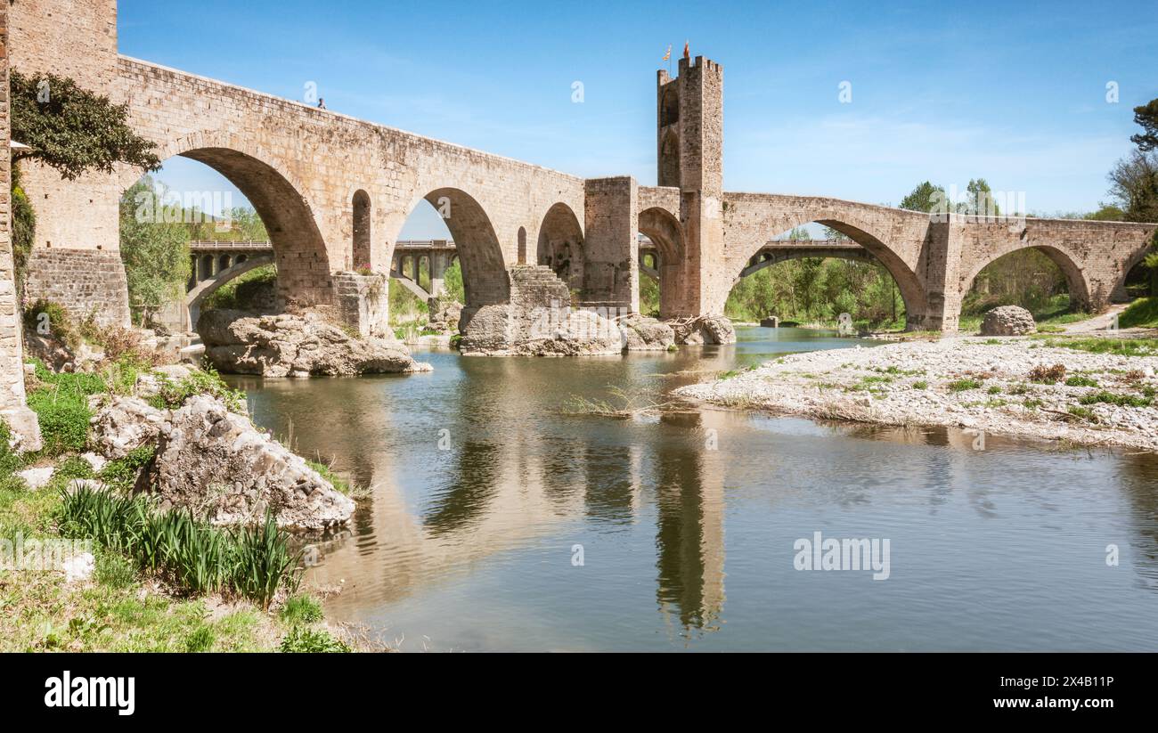 The picturesque medieval bridge of besalú, in Girona, crosses the ...