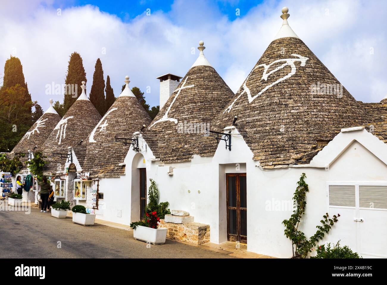 The traditional Trulli houses in Alberobello city, Apulia, Italy ...