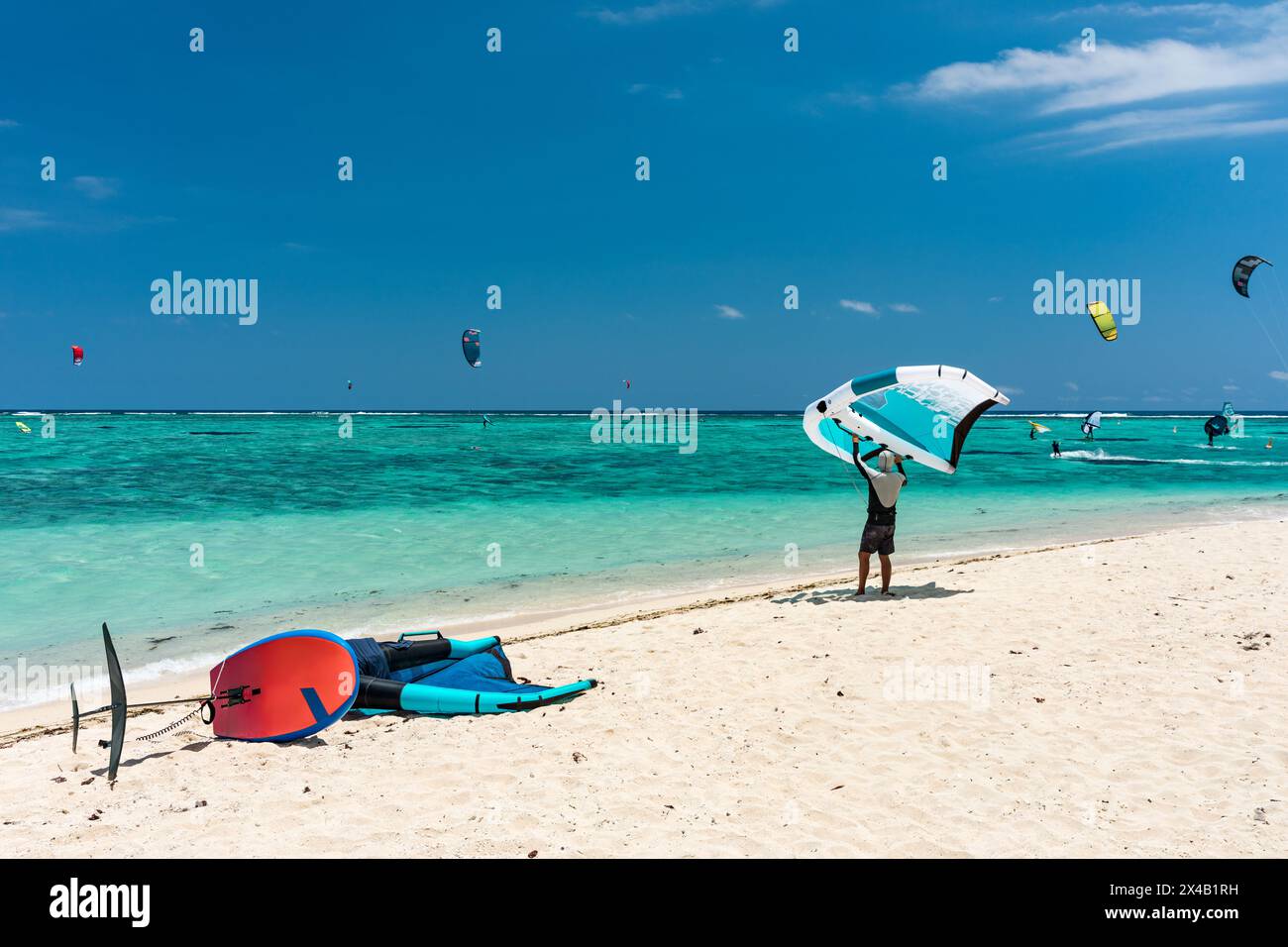 Kite surfers in the waters of Indian Ocean, Mauritius. Kite surfing in ...