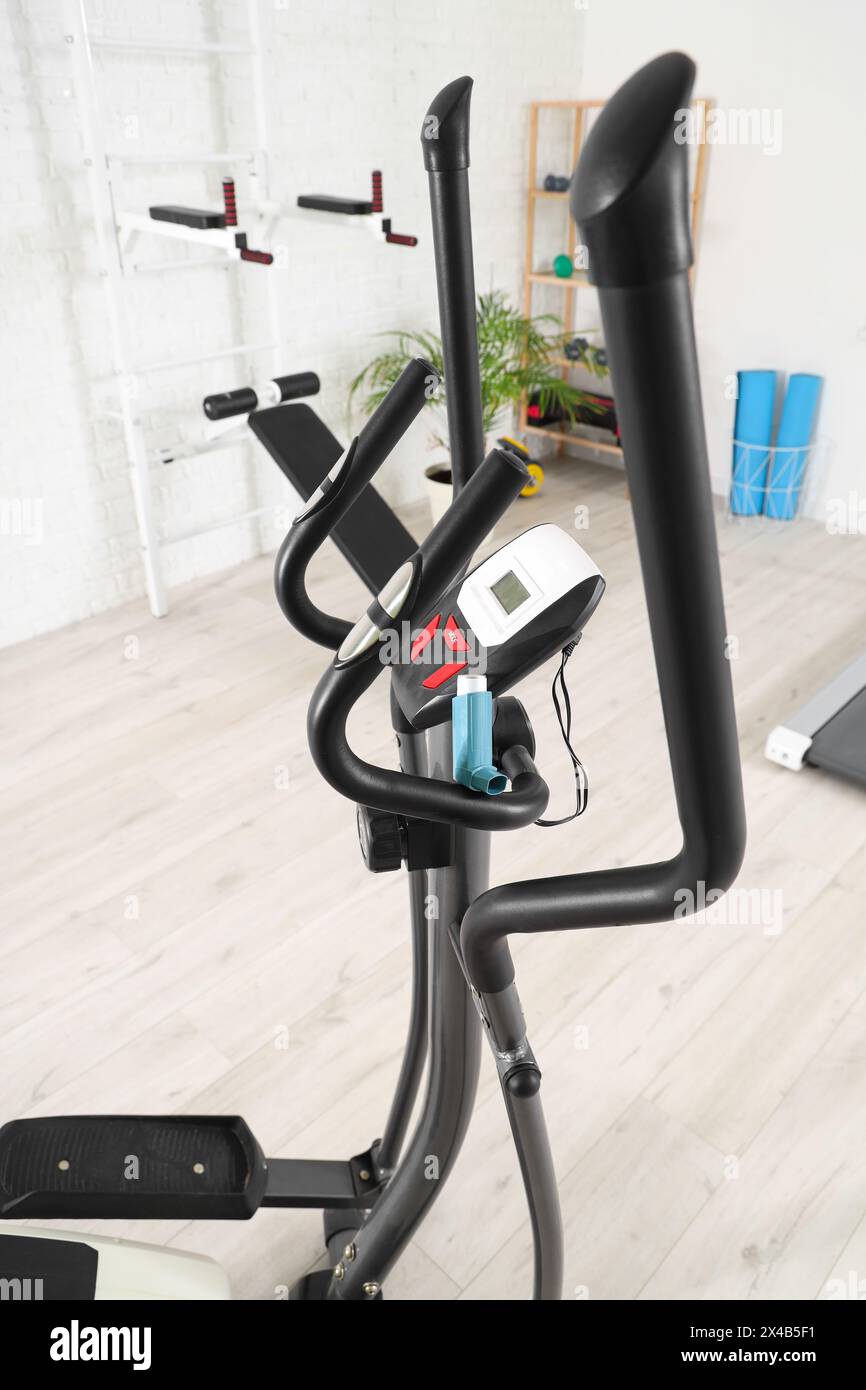 Asthma inhaler on exercise bike in gym, closeup Stock Photo - Alamy