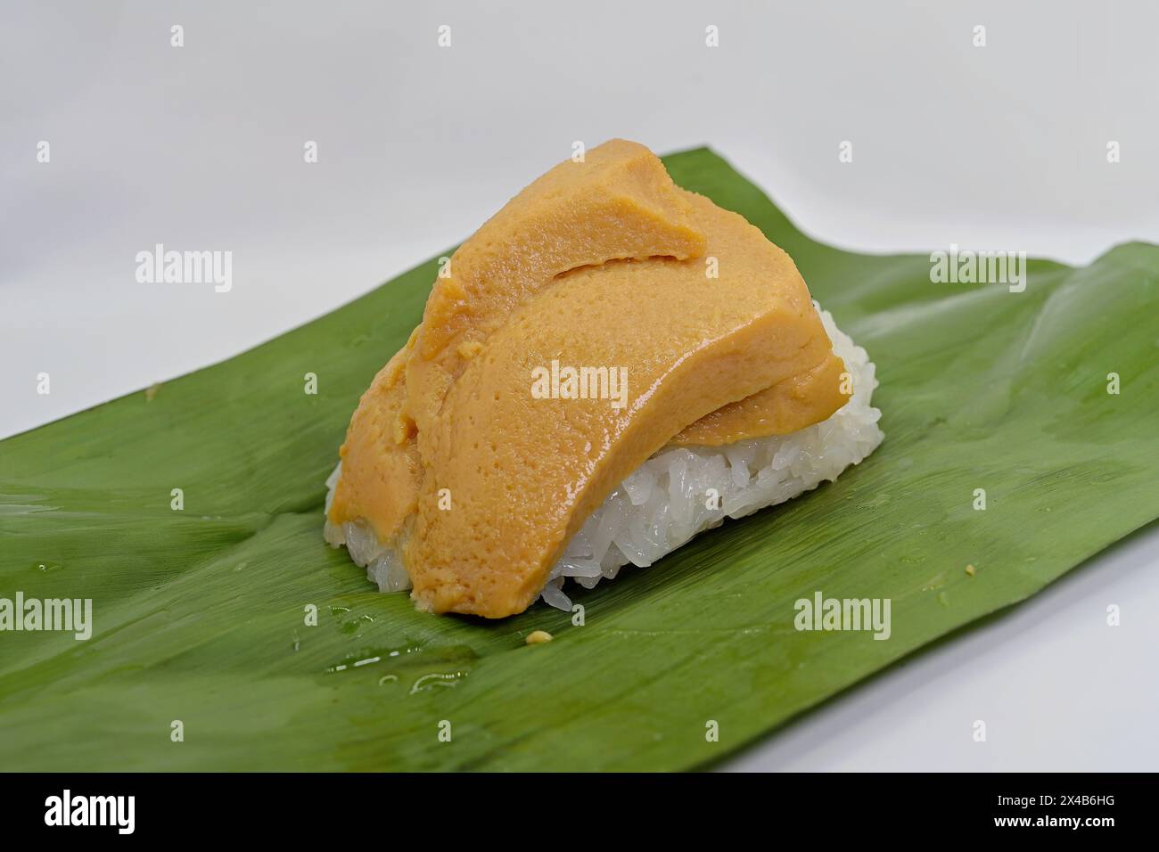 Khao niao sangkhaya or sticky rice with coconut custard with banana ...