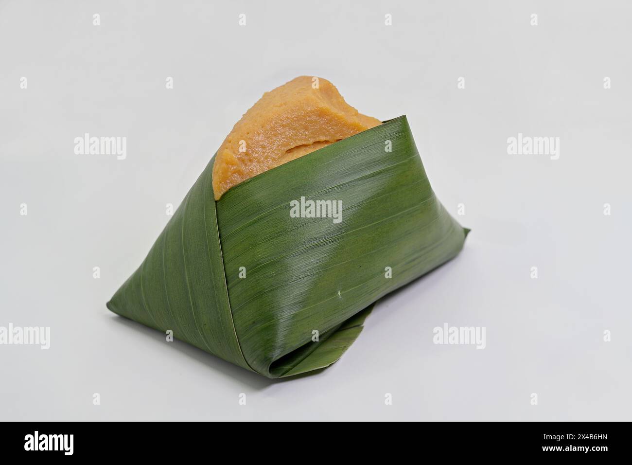 Khao niao sangkhaya or sticky rice with coconut custard wrapped with ...