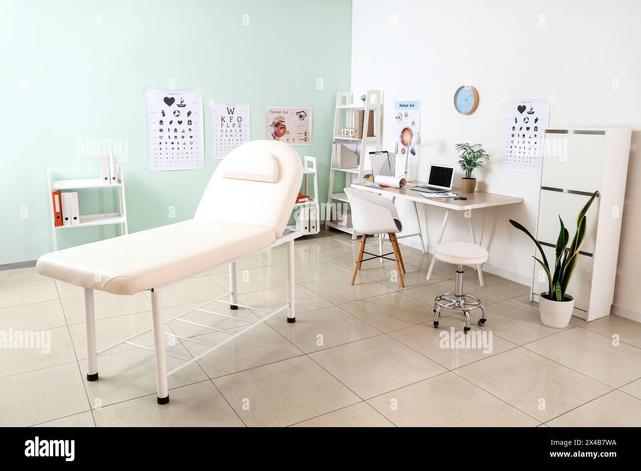 Interior of ophthalmologist's office with workplace and couch Stock ...