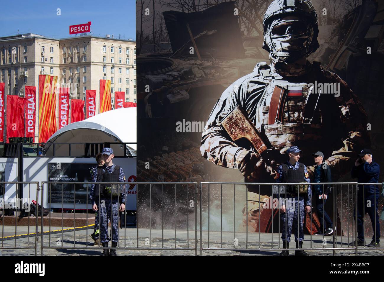 Police stands guard at a newly opened exhibition of trophy military ...