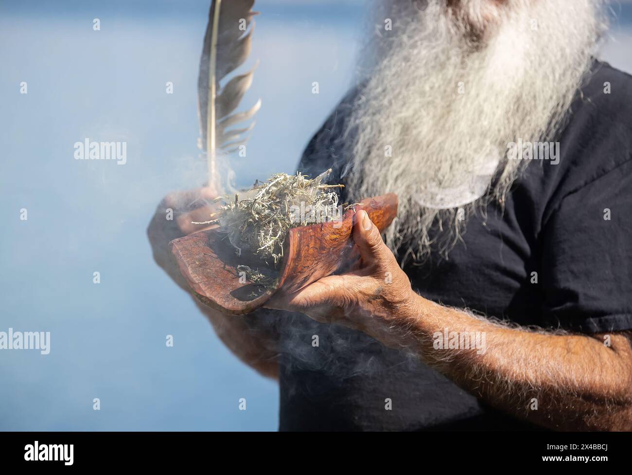 Ritual fire with green branch, smoke and fire, the smoke ritual rite at ...