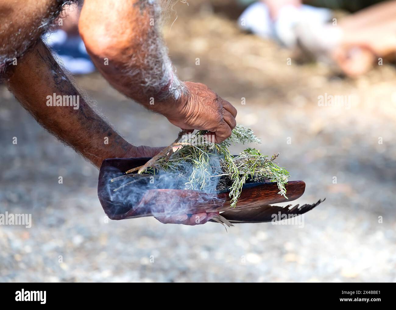 Ritual fire with green branch, smoke and fire, the smoke ritual rite at ...