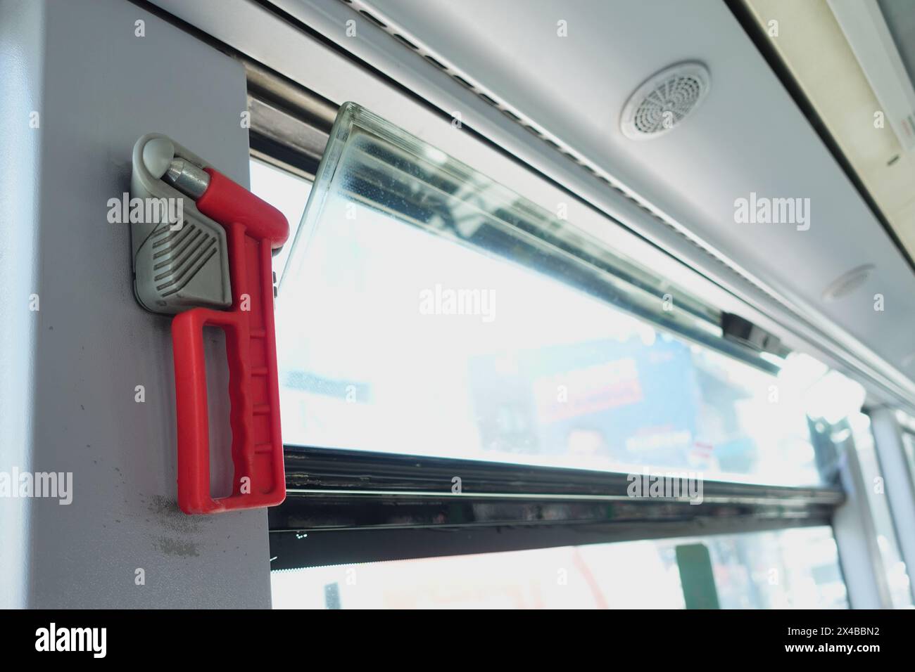 Safety Hammer in a bus and Glass breakage Stock Photo - Alamy