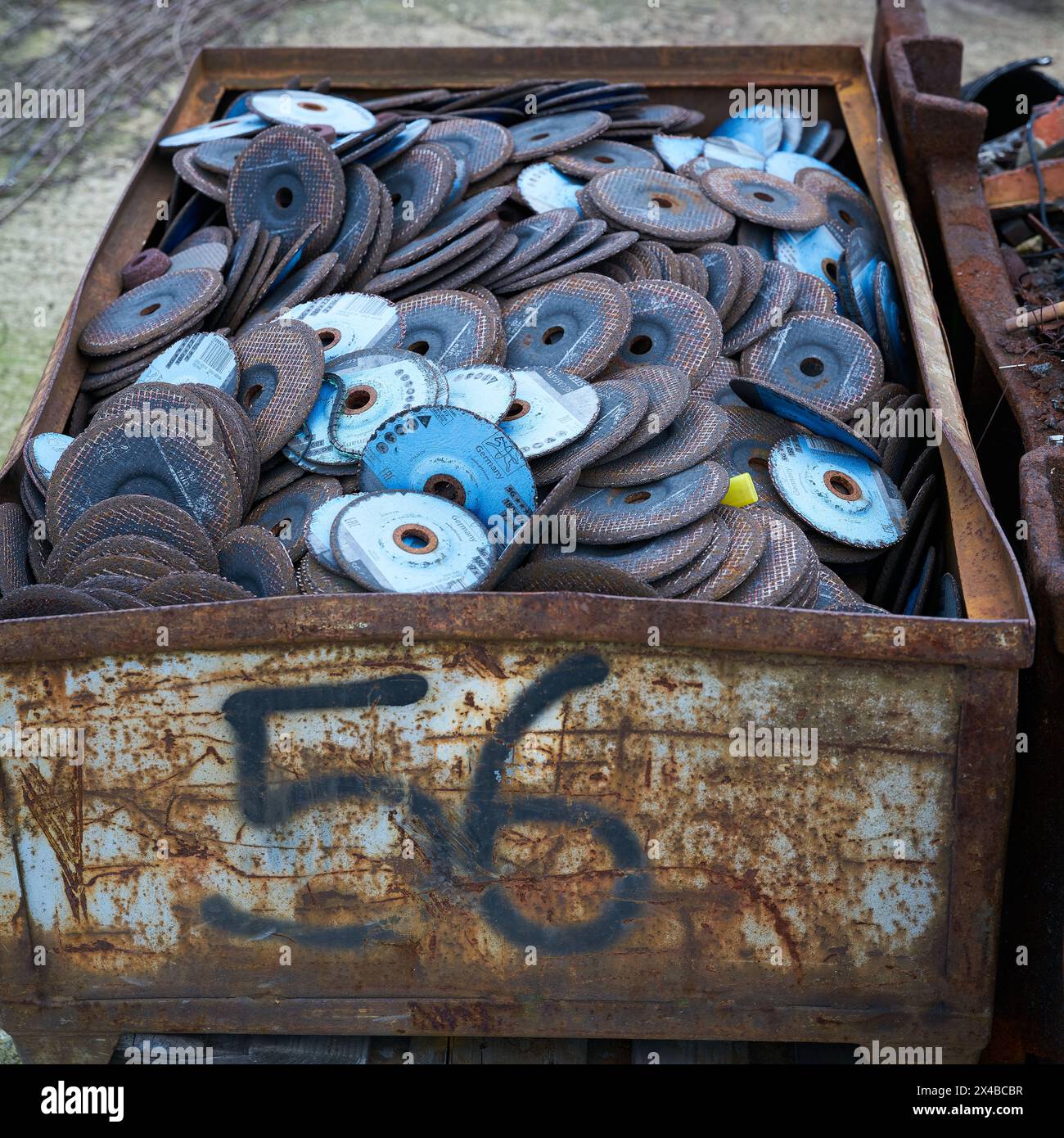 Worn, disused cutting-off wheels for metalworking on the site of an ...
