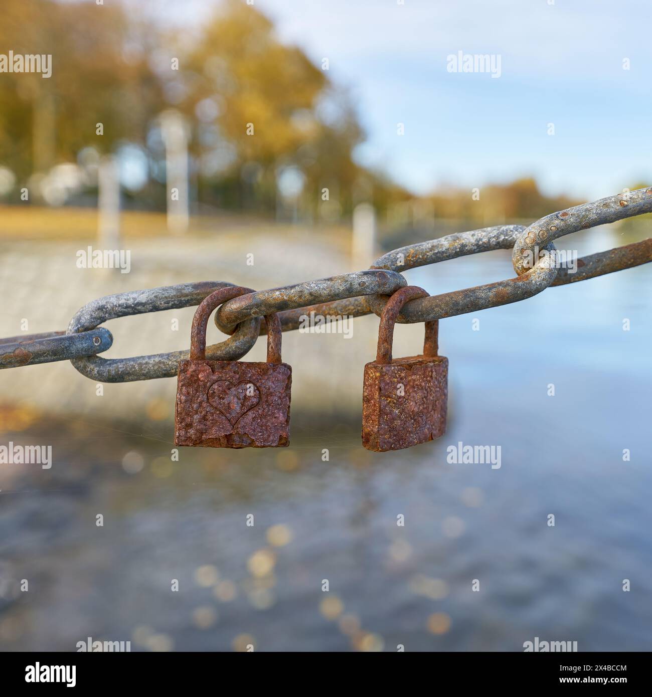 Rusted love locks on a chain on the Sundpromenade in Stralsund in ...