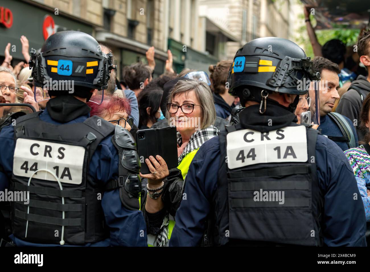 Protester trapped by riot police send messages on their phones during ...