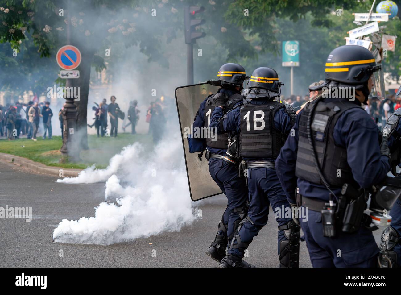 Protesters throw tear gas back at police during the annual ...