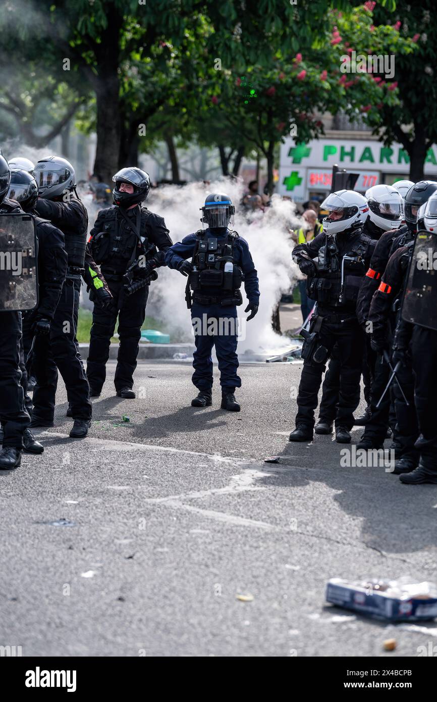 Riot police form lines as they deploy tear gas during the annual ...